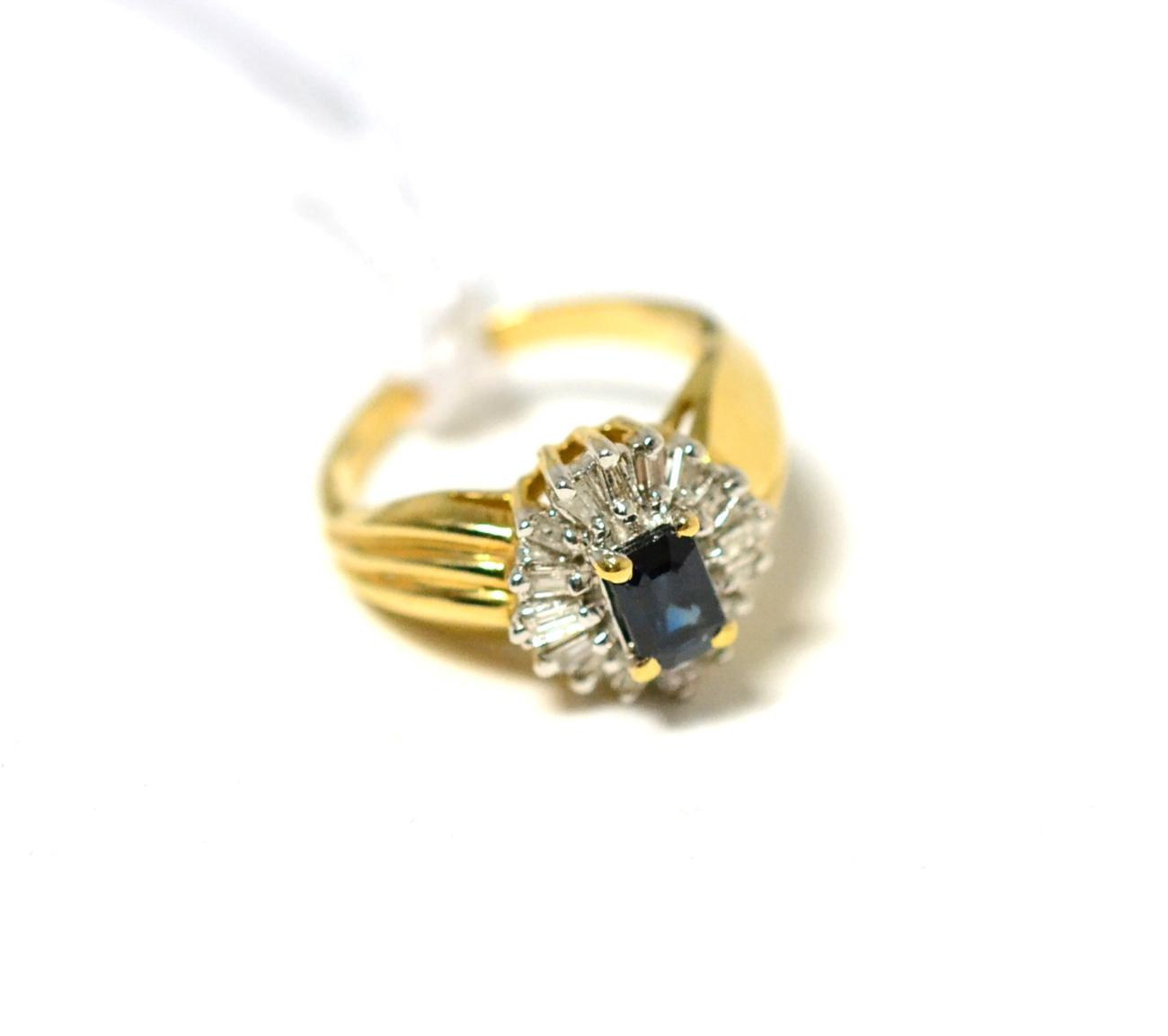 Lot 301 - A sapphire and diamond cluster ring, an
