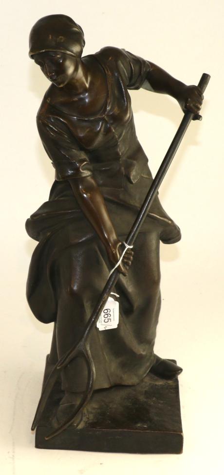 Lot 665 - Bronze figure of a lady with a pitchfork,