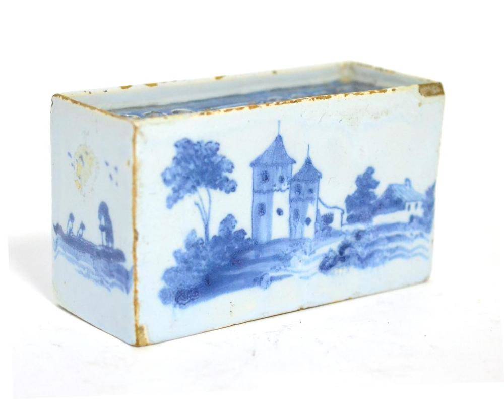 Lot 116 - An English Delft flower brick, circa 1760,