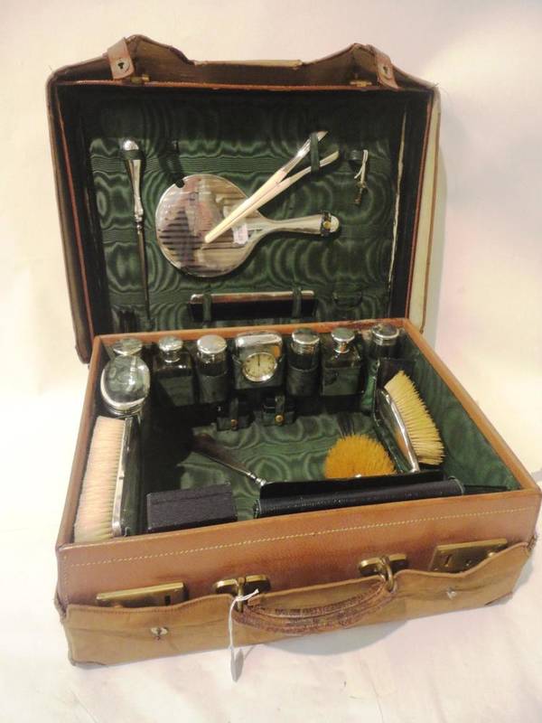 Lot 1217 - A Leather Fitted Travelling Toilet Case,