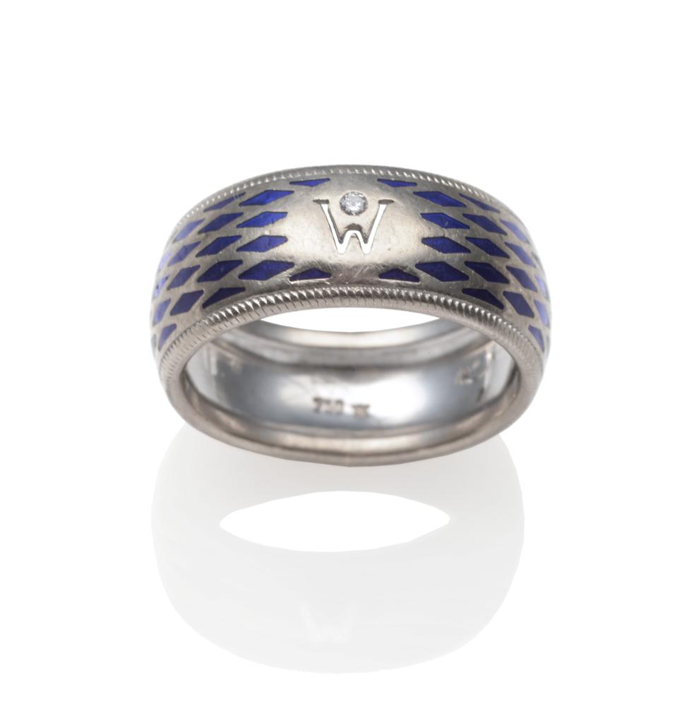 Lot 2021 - A Diamond and Blue Enamel Band Ring, by
