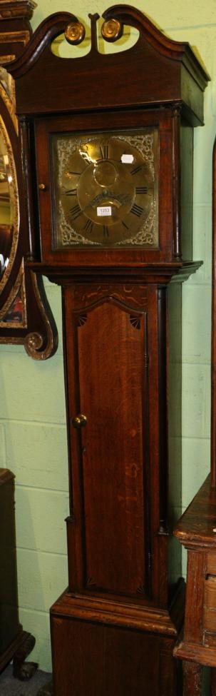 Lot 1253 - A cross banded oak longcase clock, the