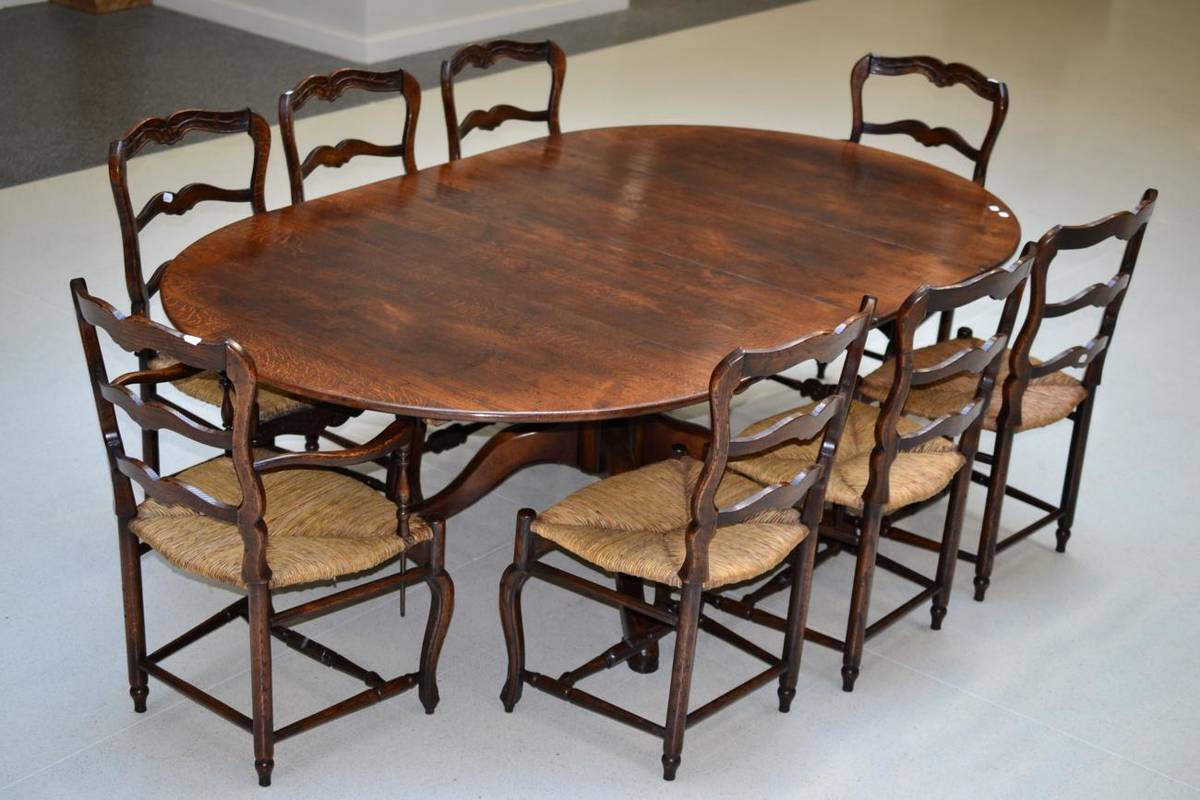 Lot 1009 - A Reproduction Oak Extending Dining Table,