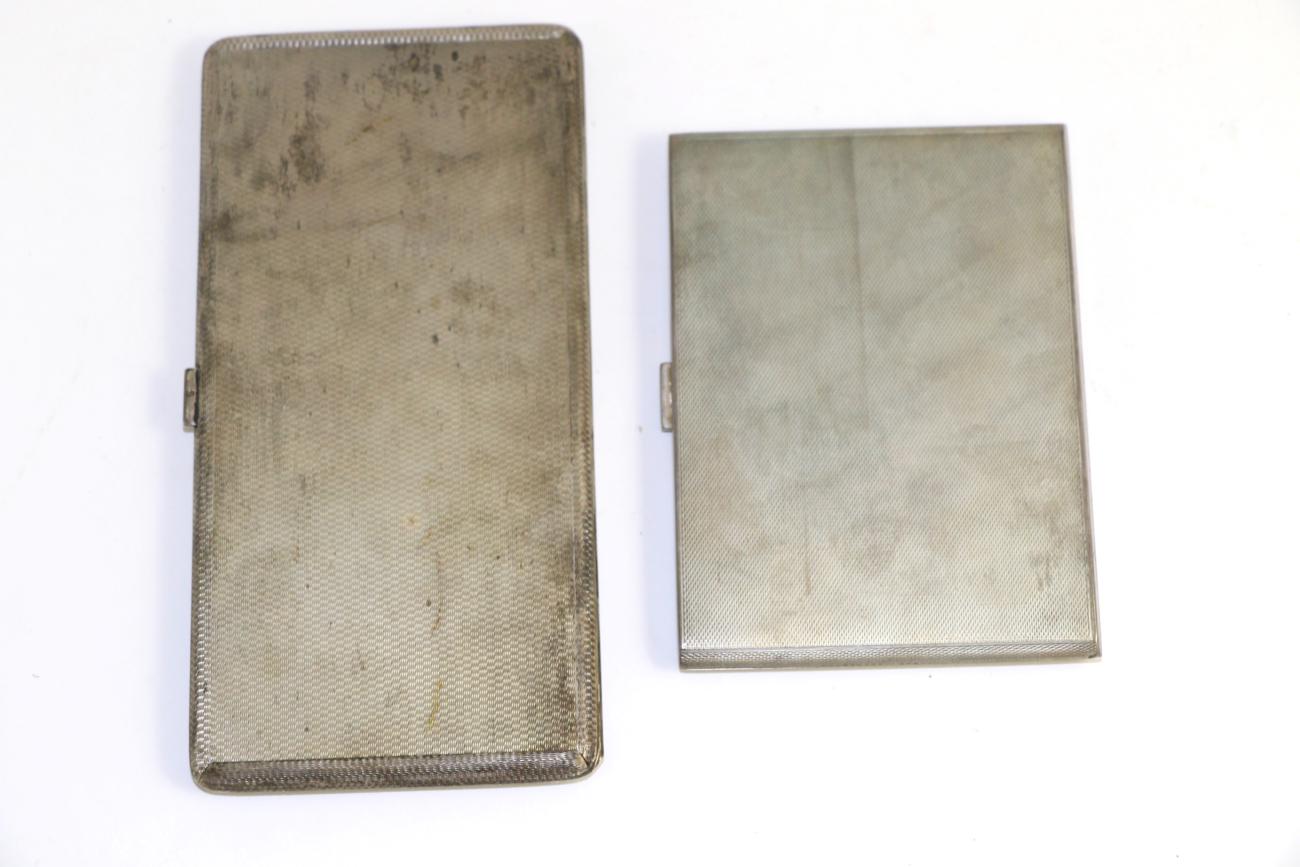 Lot 455 - Two silver cigarette cases with engine
