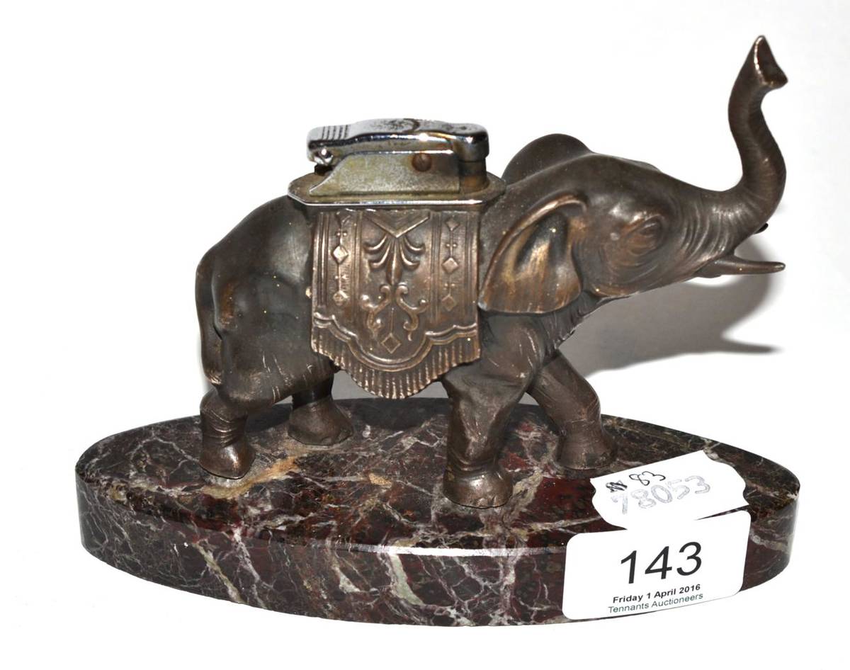 Lot 143 - An elephant form table lighter