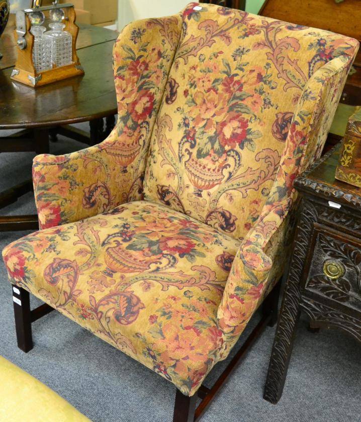 Lot 1426 - A Georgian wing back chair