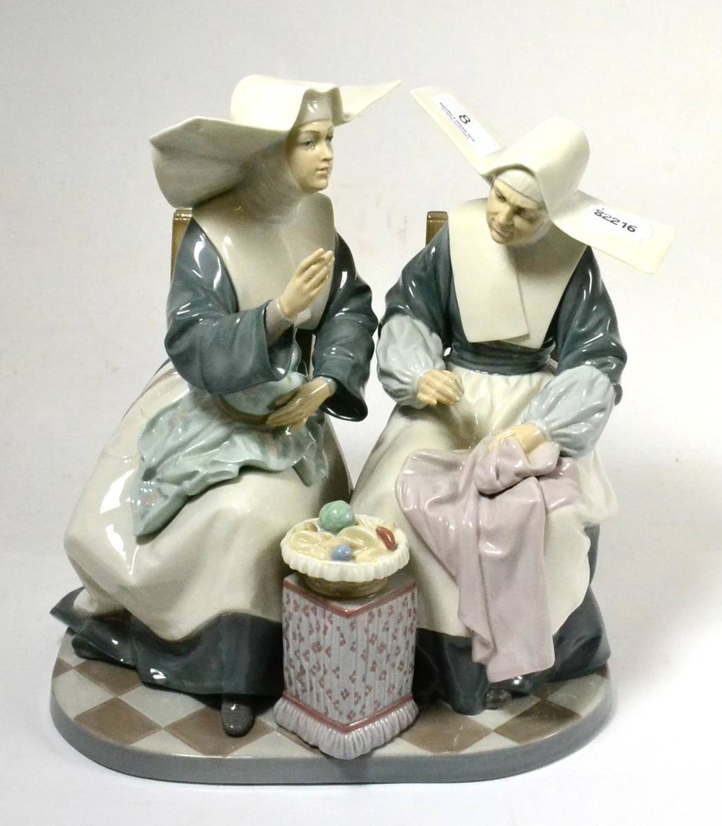 Lot 8 - Lladro porcelain group, two seated nuns in