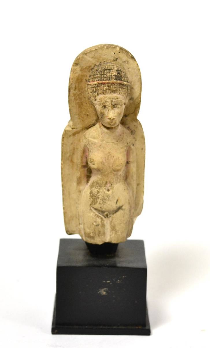 Lot 25 - An Egyptian funerary carved limestone statue