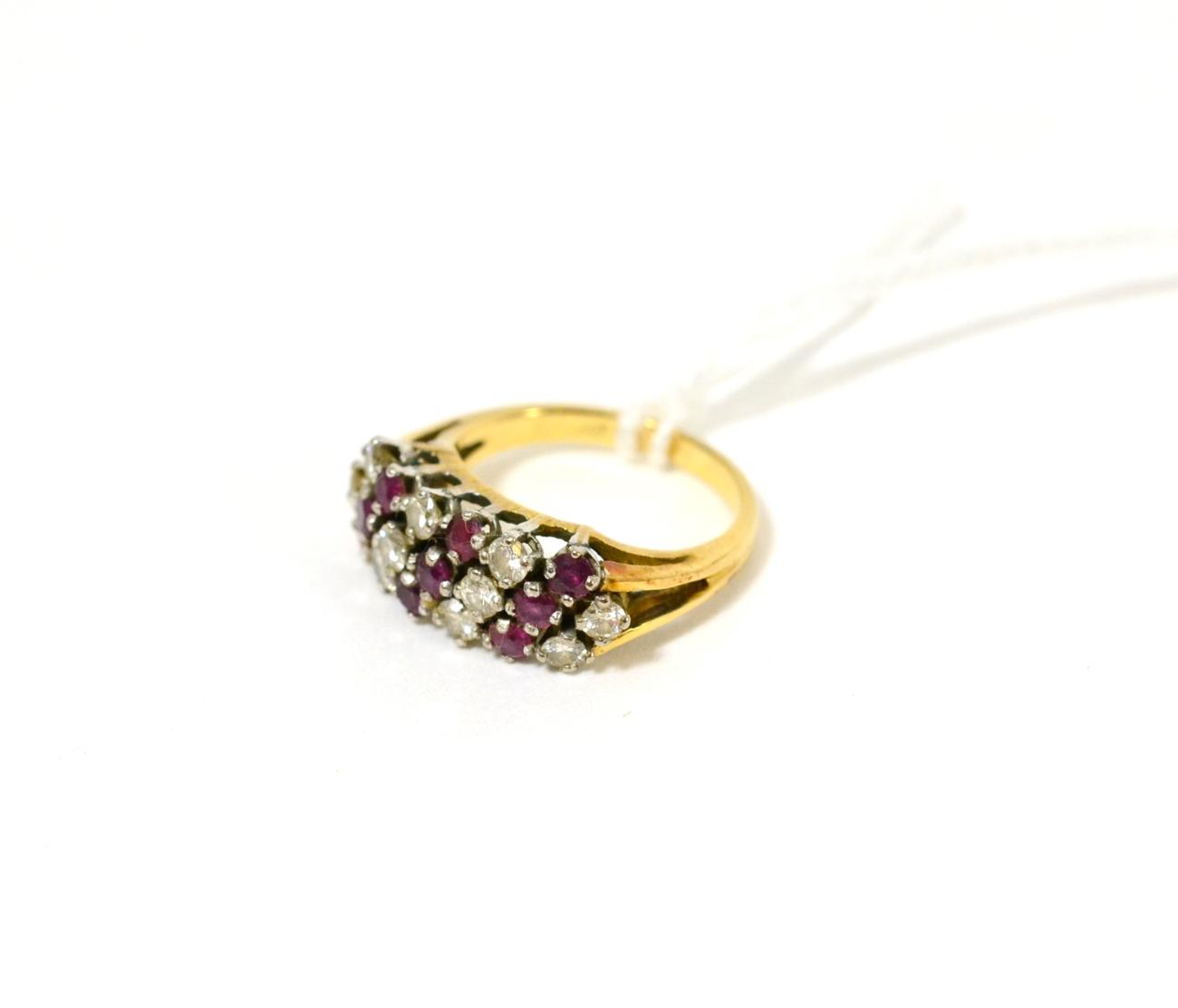 Lot 113 - A ruby and diamond cluster ring, of diagonal