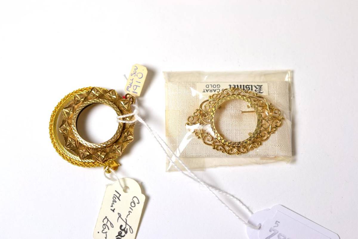 Lot 164 - Three coin mounts