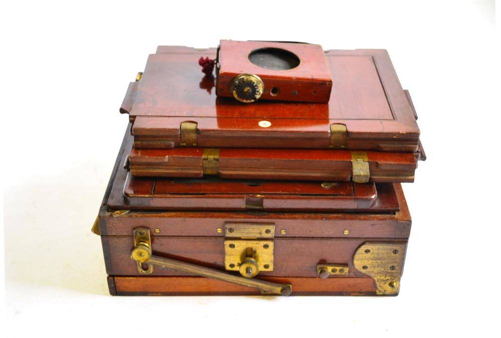 Lot 1145 - A Mahogany and Brass Folding Field Camera