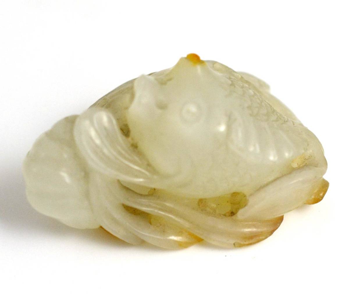 Lot 119 - A Chinese Jade Carving of a Fish, with some