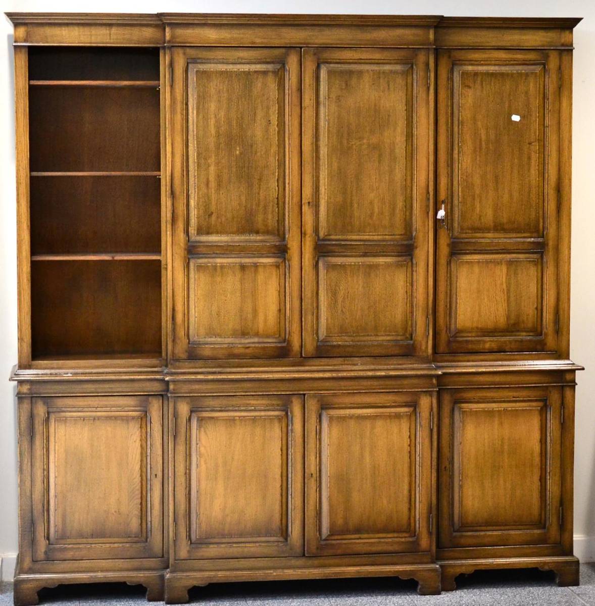 Lot 3019 - A Reproduction Oak Breakfront Bookcase, of
