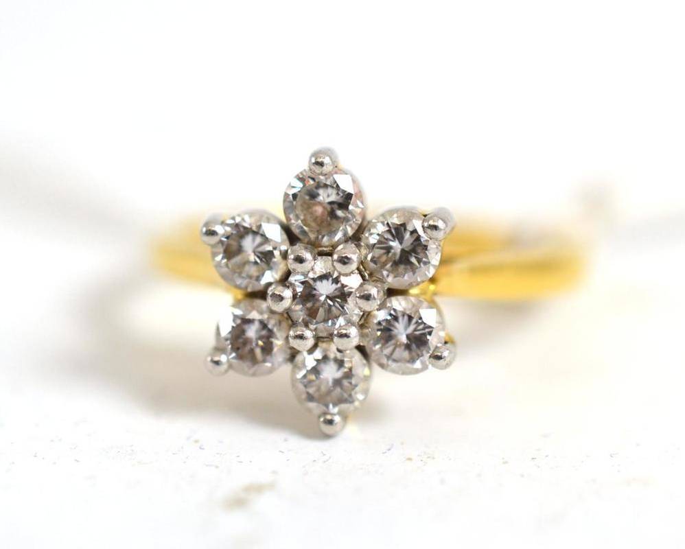 Lot 102 - An 18ct gold diamond cluster ring, total