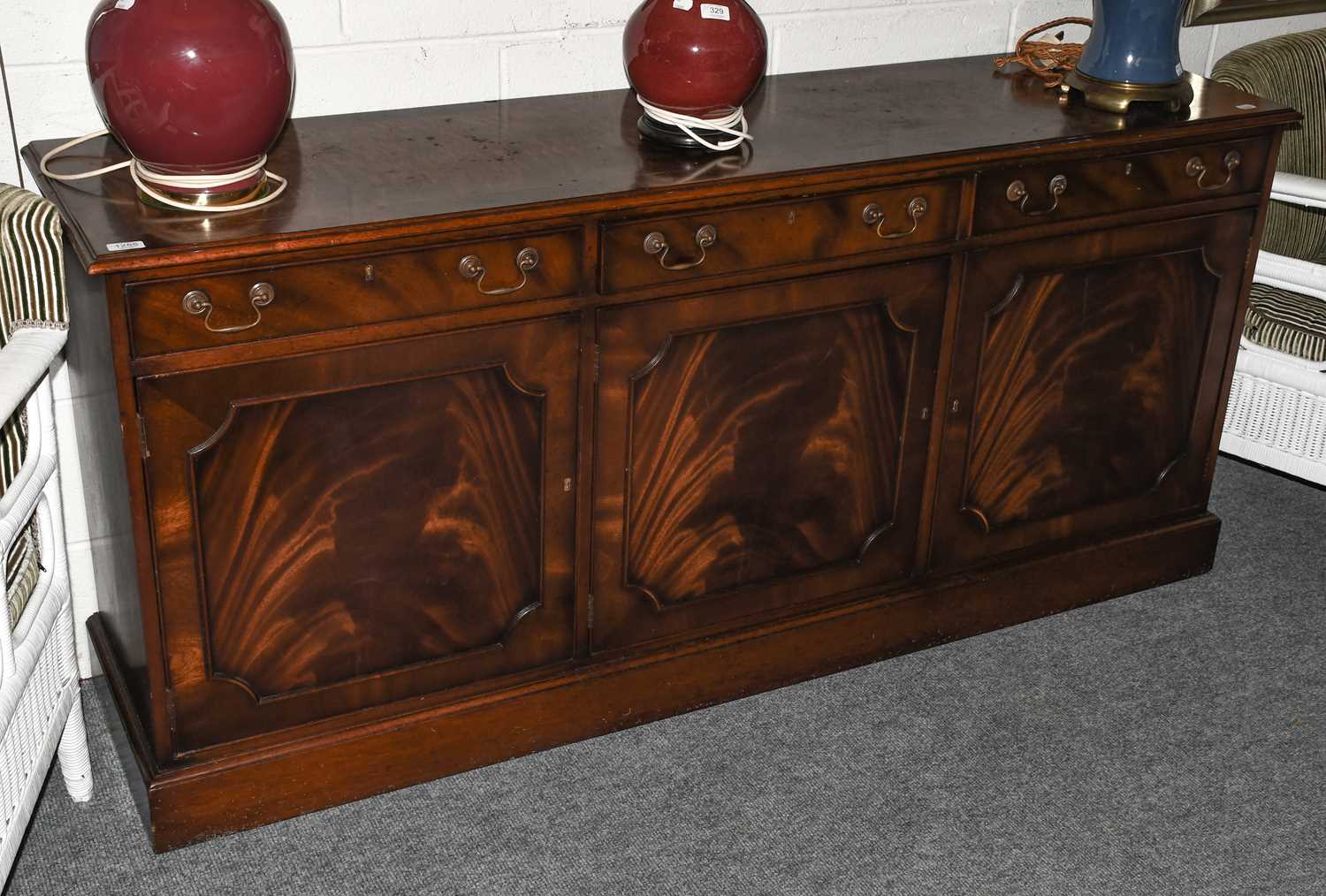 Lot 1121 - A reproduction mahogany sideboard fitted