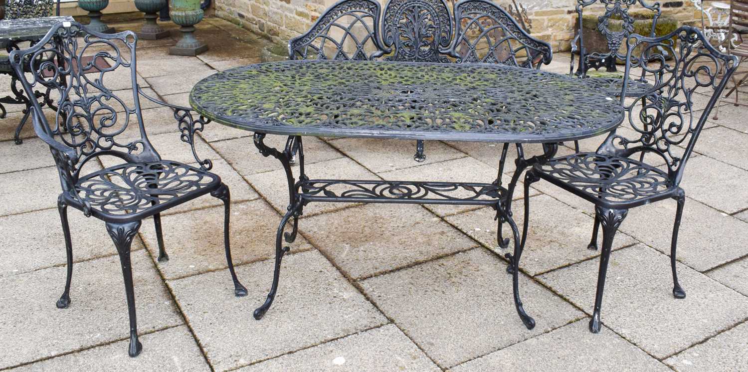 Lot 1303 - An oval black-painted metal garden table,