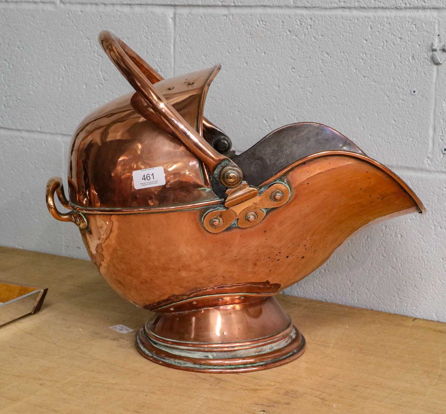 Lot 461 - A Victorian copper coal helmet with pivoting