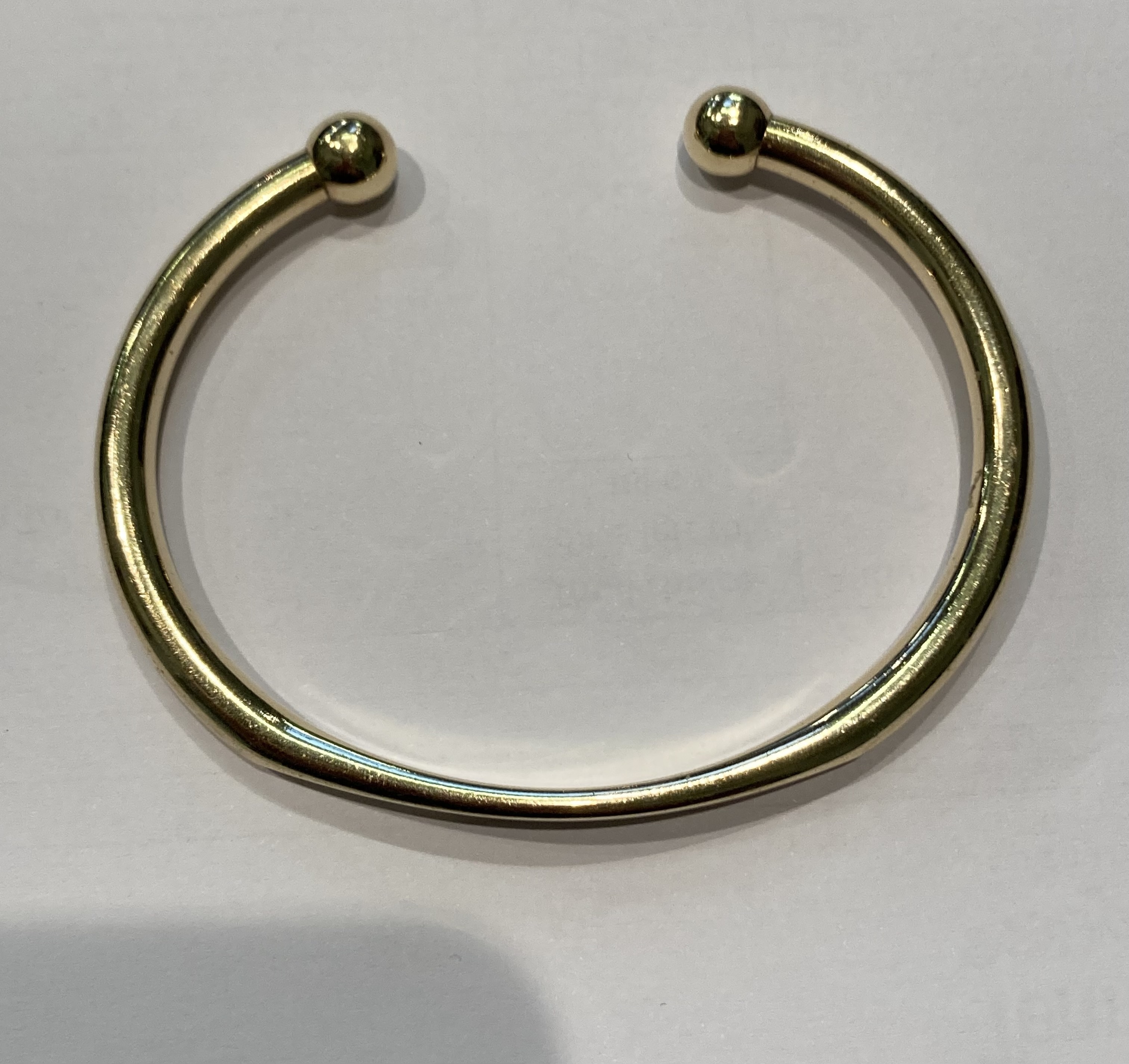 Lot 2 - A 9 carat gold torque bangle, inner