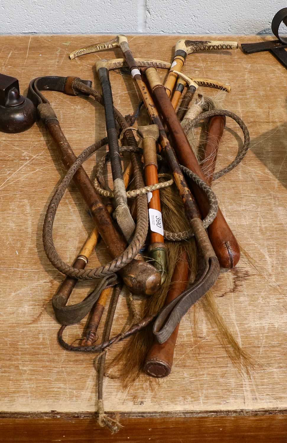 Lot 390 - Nine riding/hunting crops, including