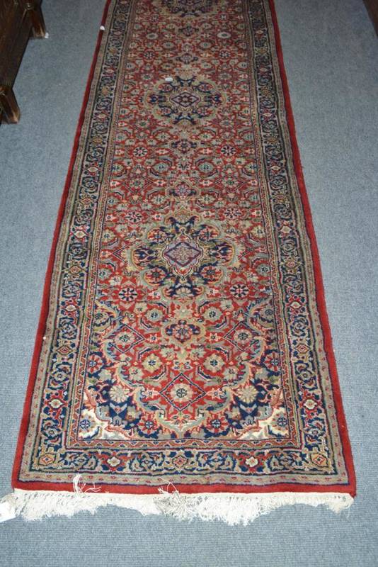 Lot 584 - Narrow Indian runner, the crimson field of