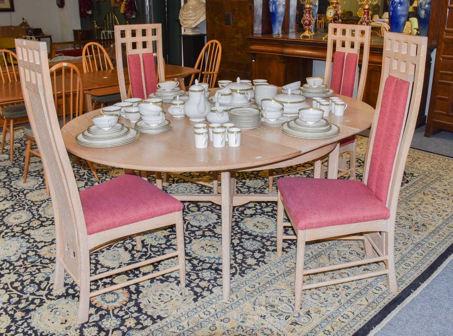 Lot 1167 - A modern Reprodux limed oak extending