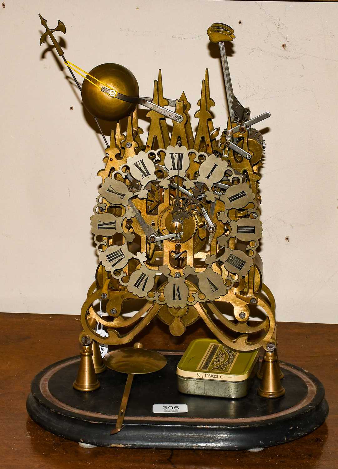 Lot 395 - A modern reproduction skeleton clock,