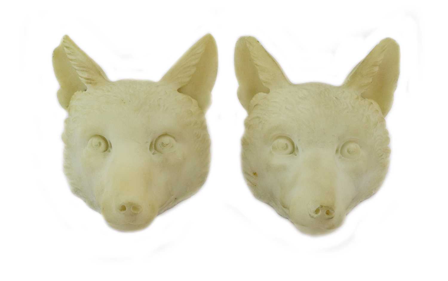 Lot 302 - A Pair of Carved Alabaster Fox Masks, early