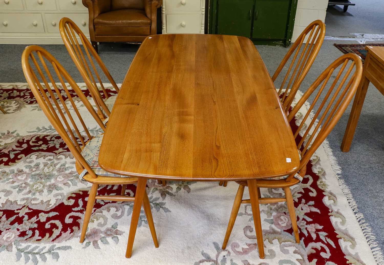 Lot 1259 - An Ercol Windsor table and set of six