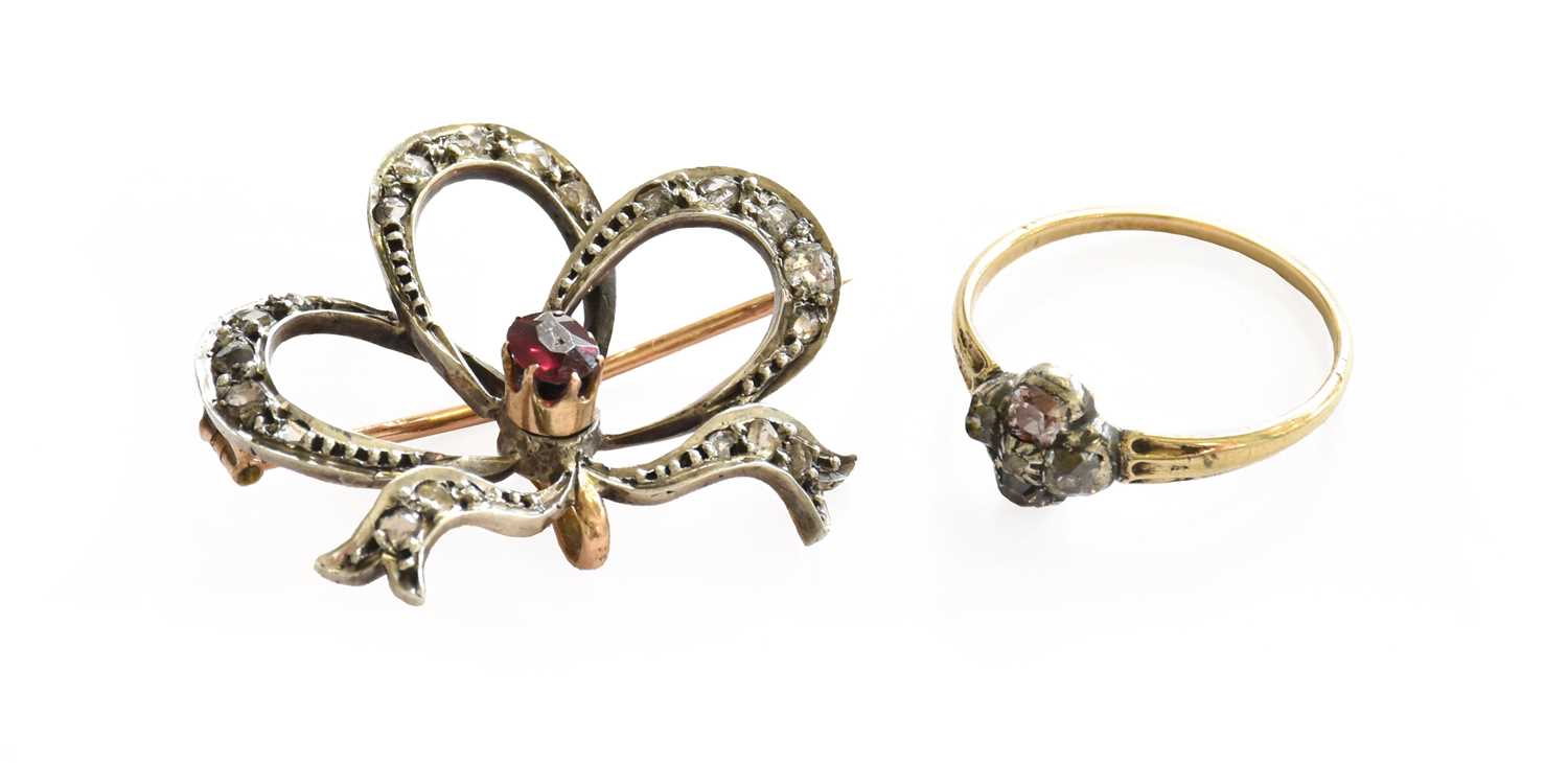 Lot 244 - A diamond and synthetic ruby bow