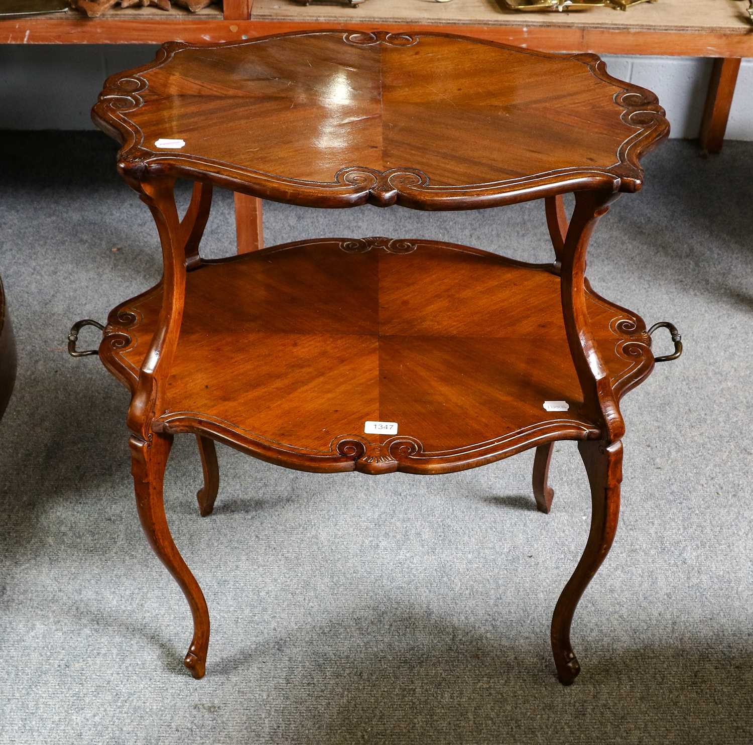Lot 1347 - A 20th-century-shaped two-tier table, the