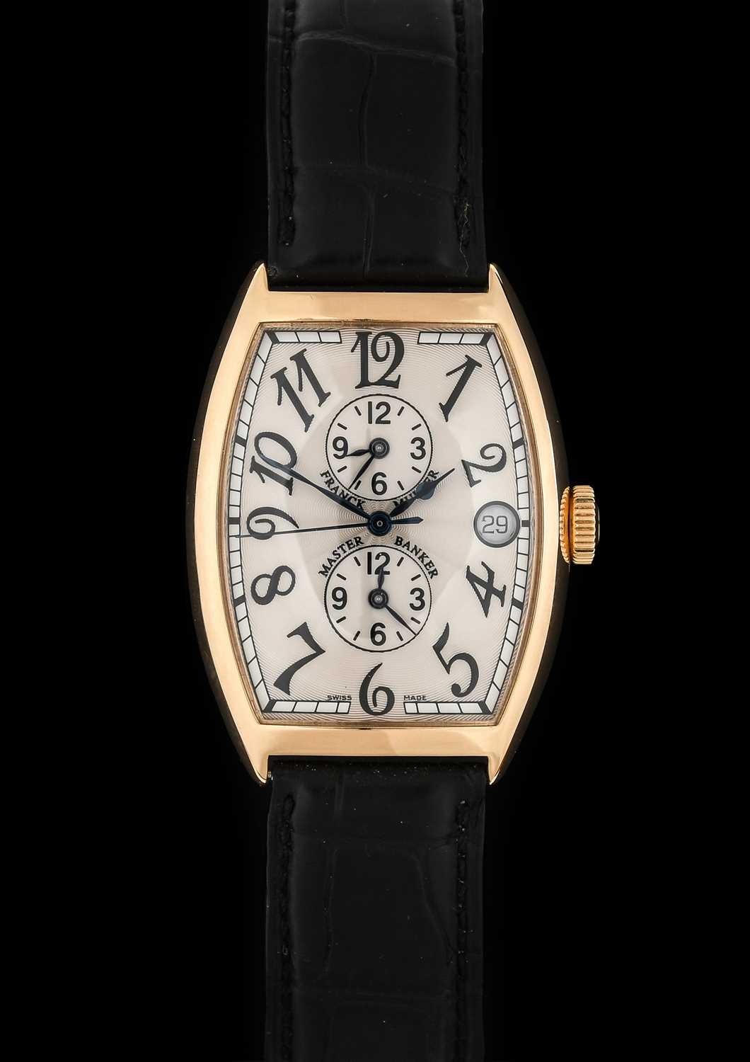 Lot 2204 - An 18 Carat Gold Tonneau Shaped Dual Time