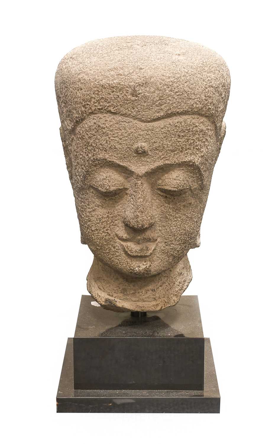 Lot 217 - A South East Asian Carved Stone Head of