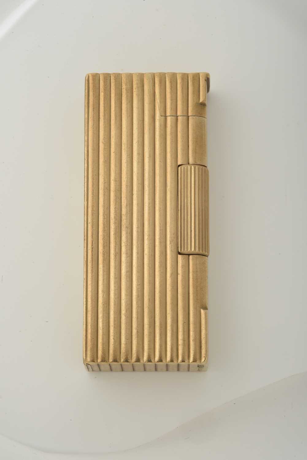 Lot 2071 - An Elizabeth II Gold Cigarette-Lighter