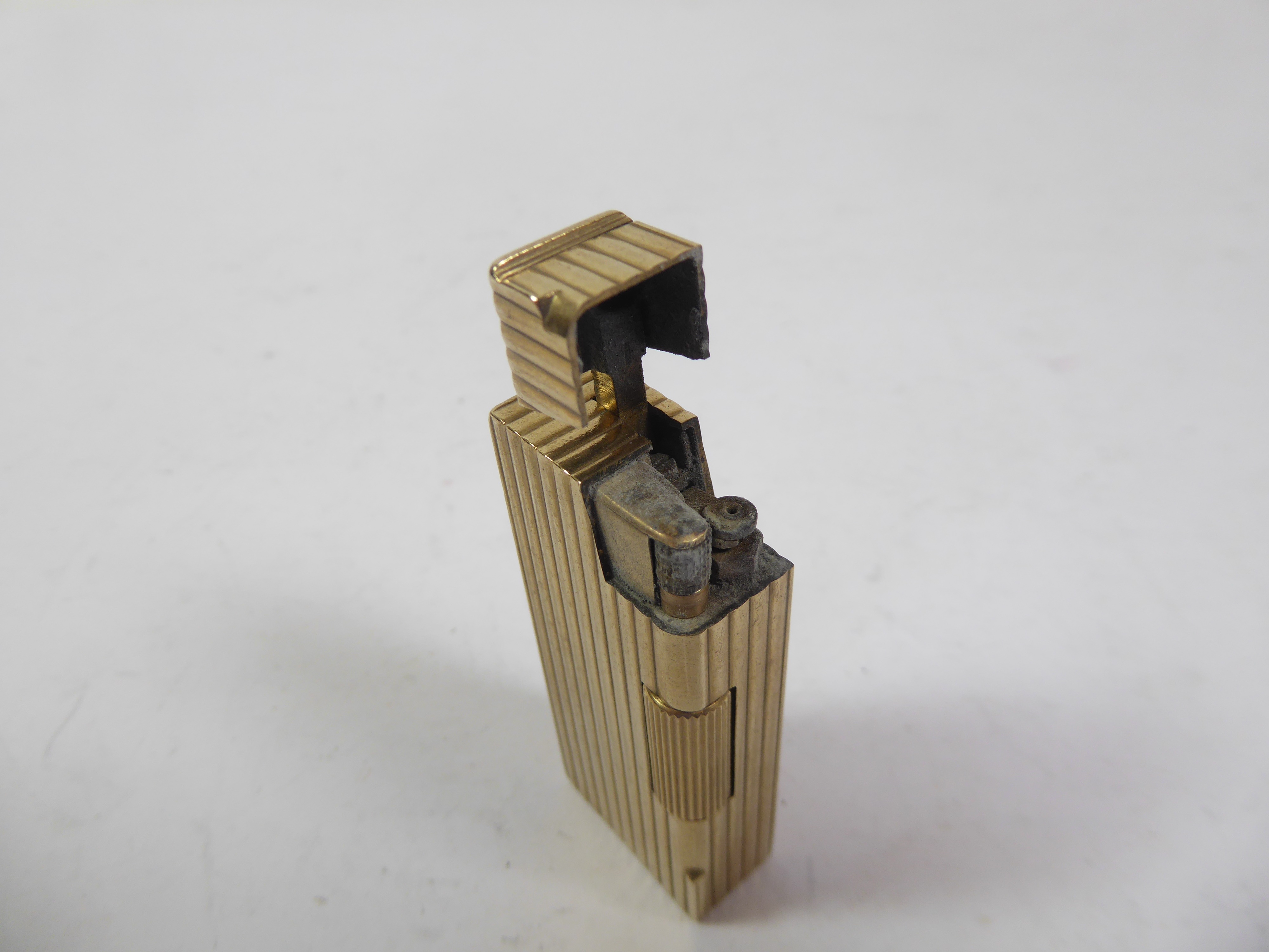 Lot 2071 - An Elizabeth II Gold Cigarette-Lighter
