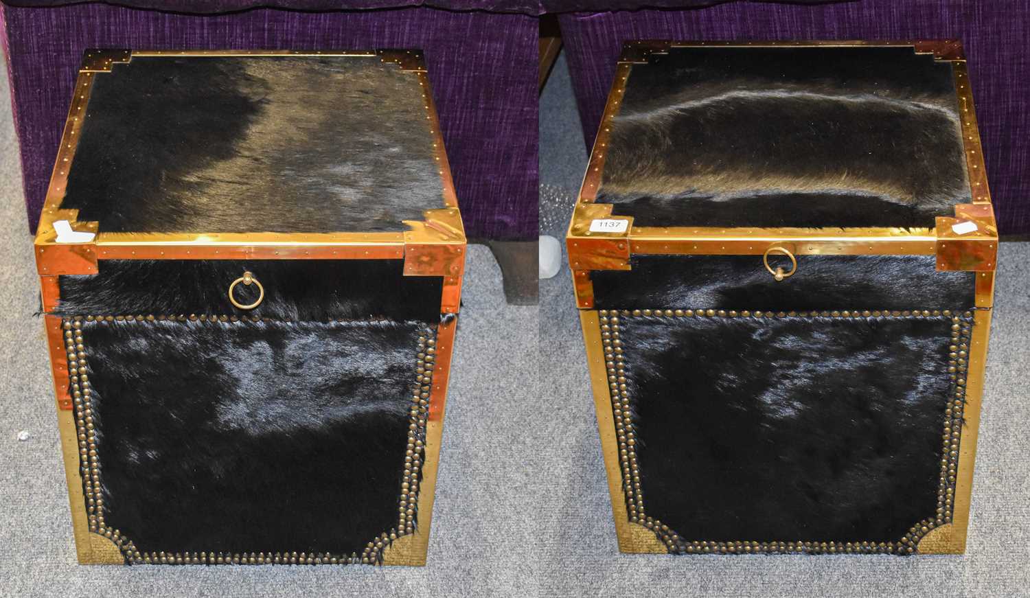 Lot 1137 - A Pair of Black Cow Hide Chests with
