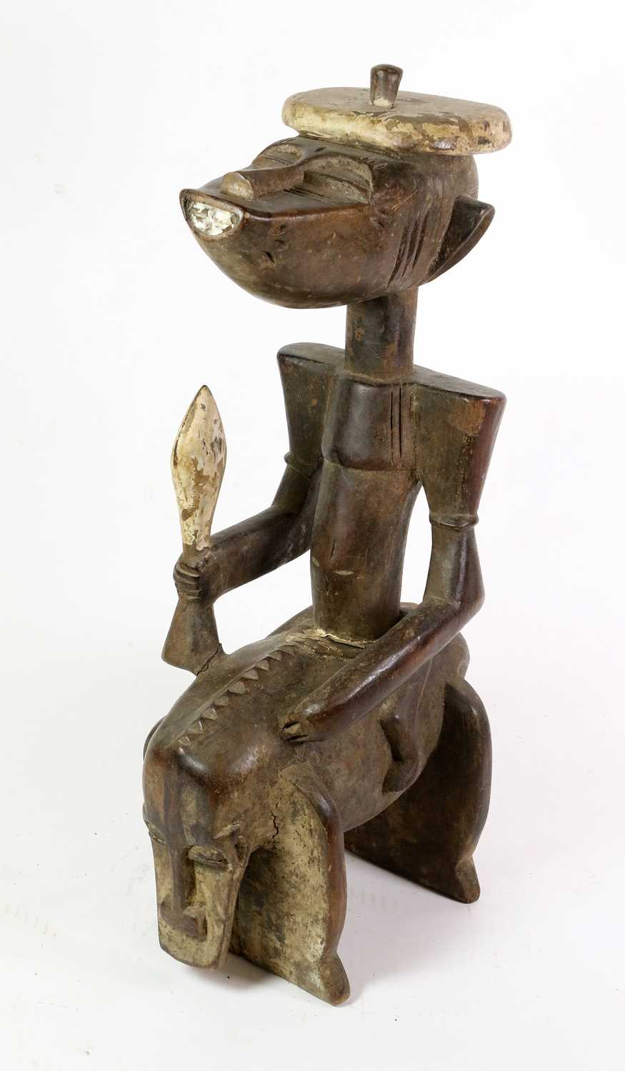 Lot 229 - A Senufo Carved Wood Divination Figure of