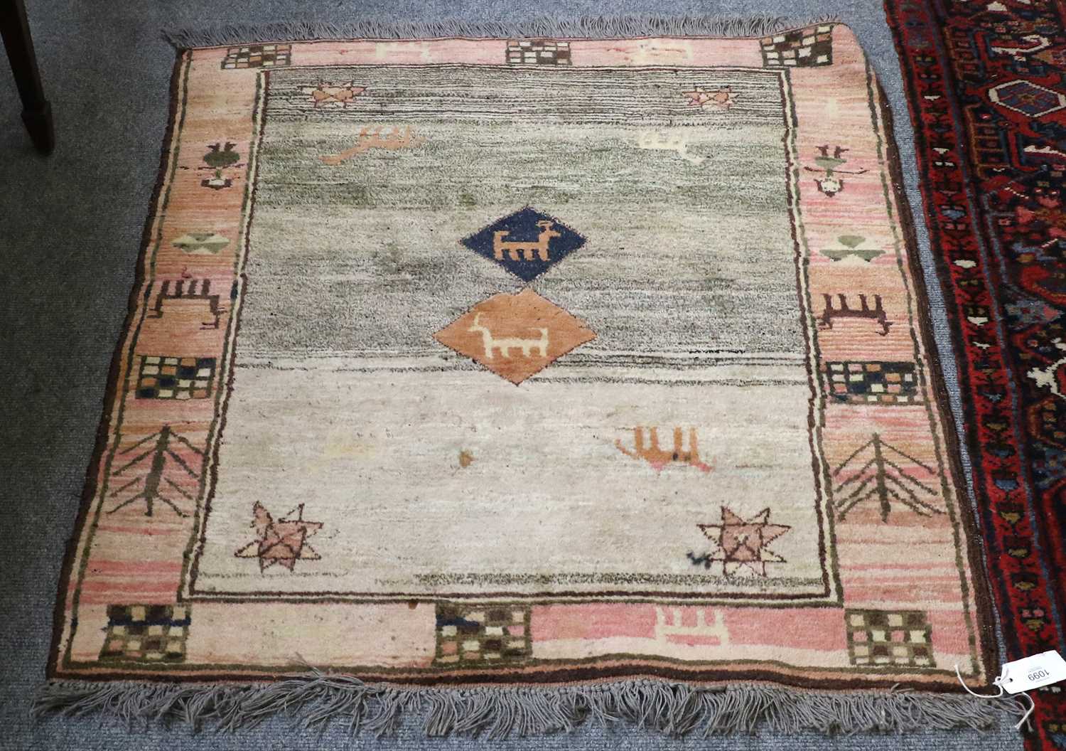 Lot 1099 - A Gabbeh Rug, the abrashed field of