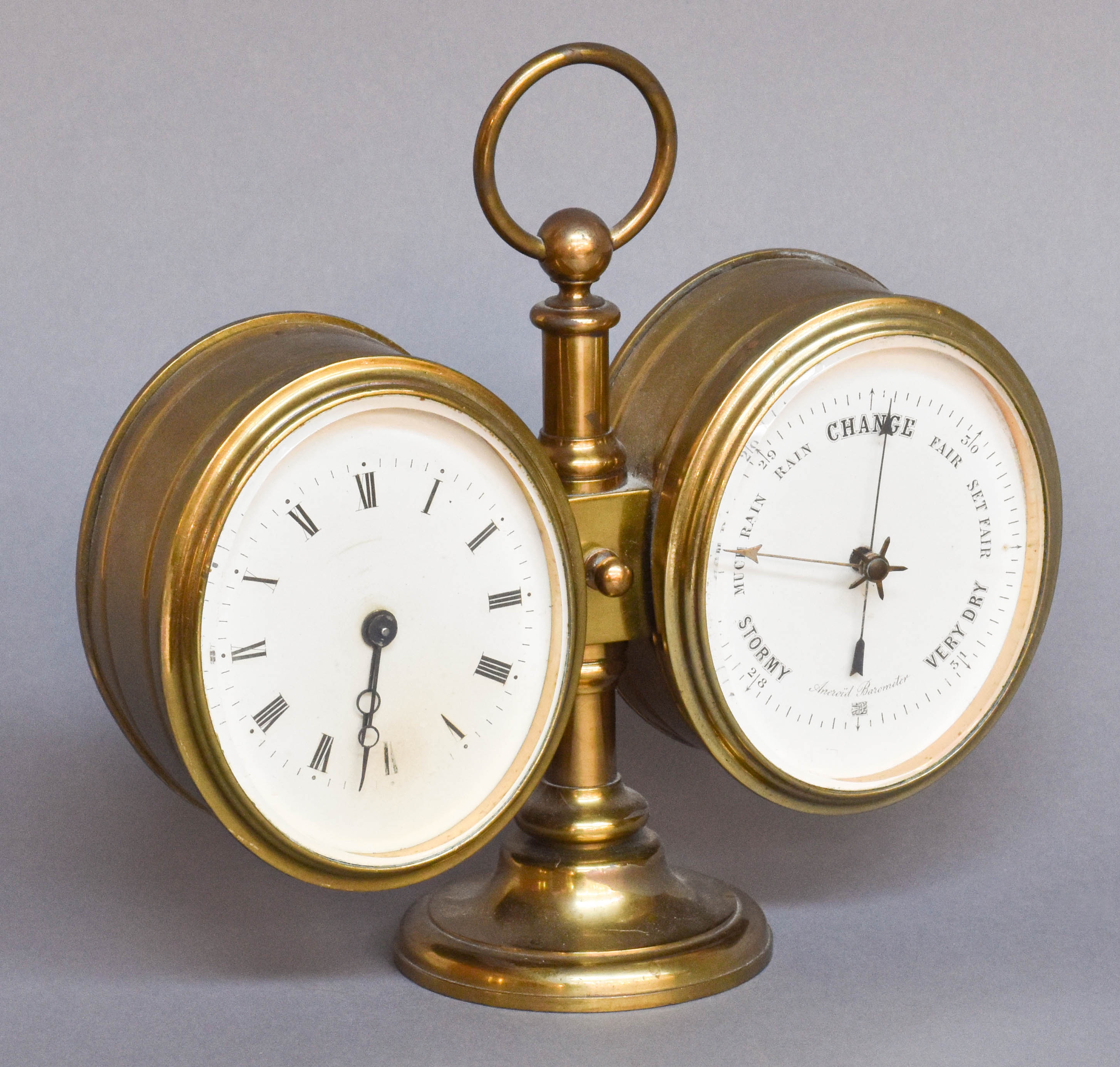 Lot 85 - A Brass Compendium Clock/Aneroid Barometer,