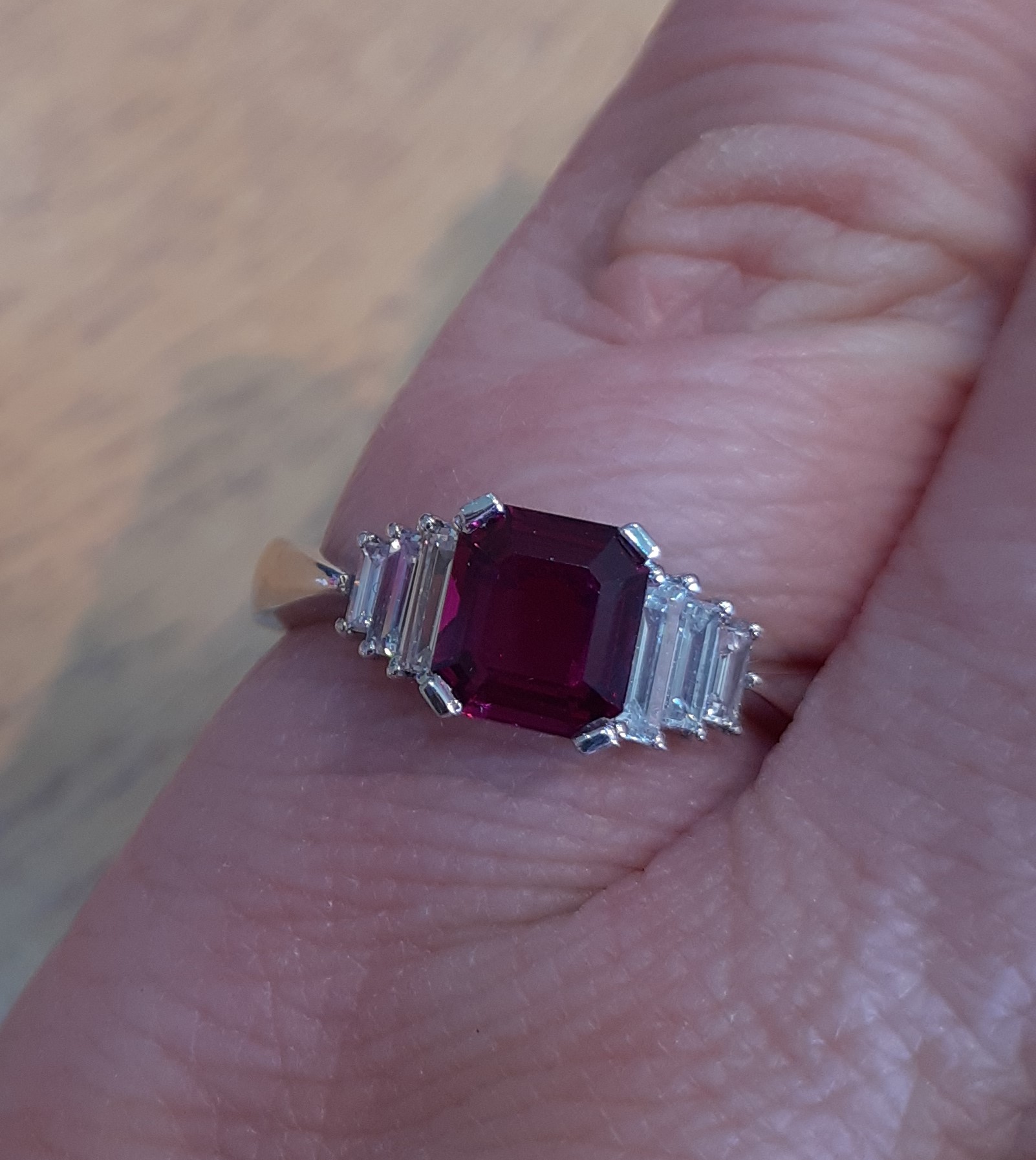 Lot 2162 - A Ruby and Diamond Ring the emerald-cut