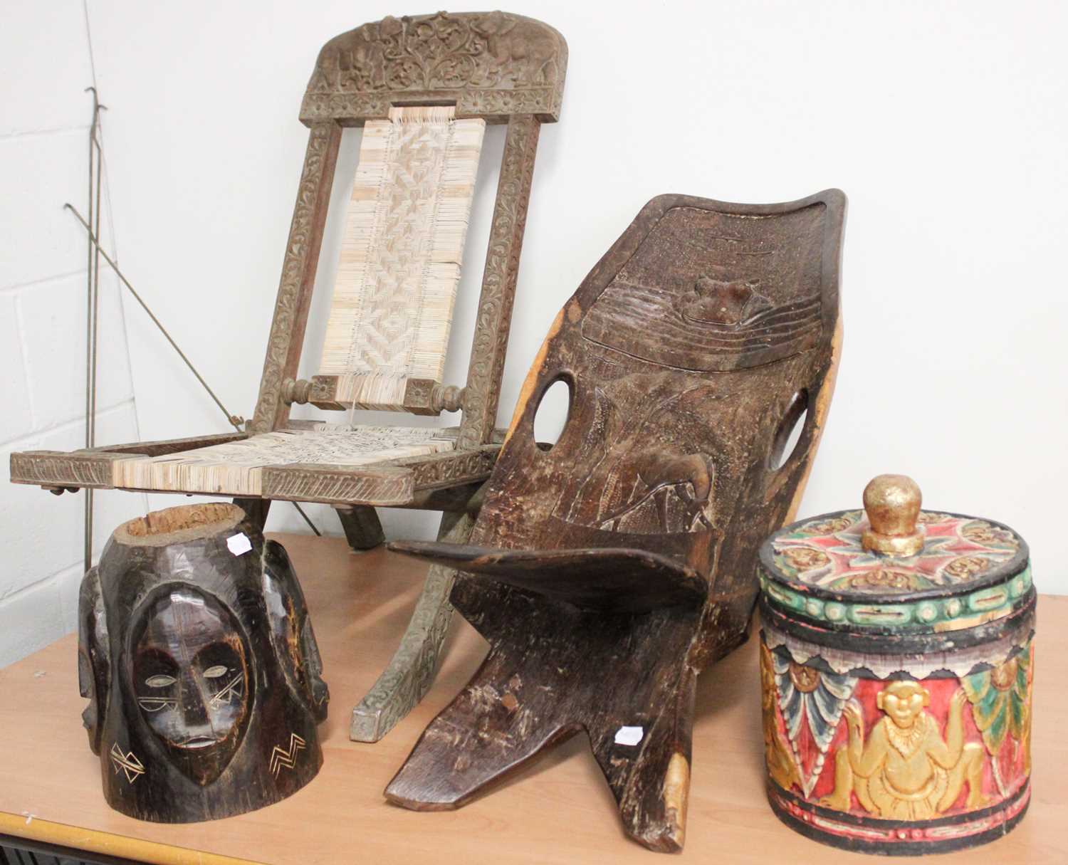 Lot 1258 - Folding carved Indian chair, African chair,