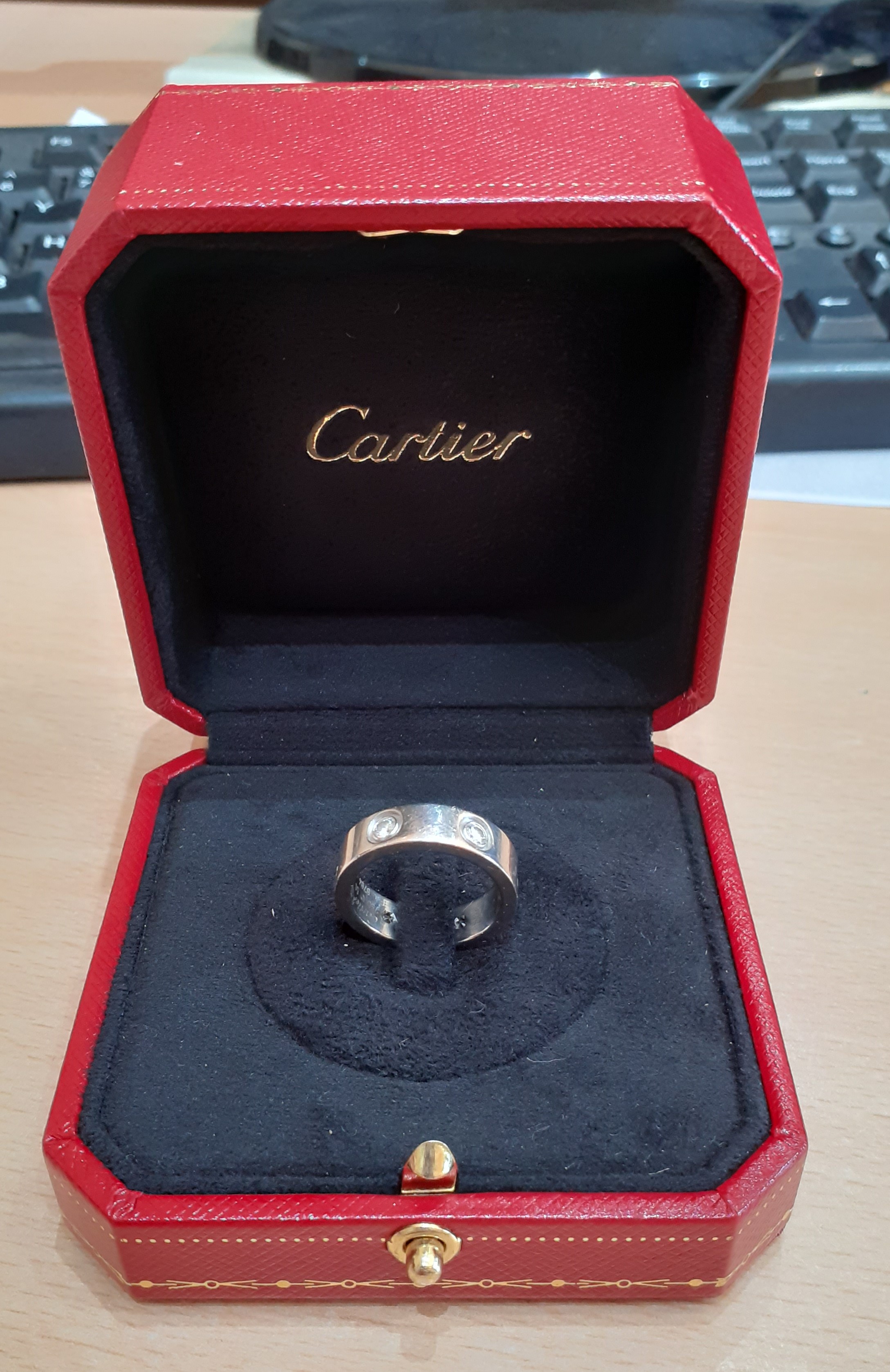 Lot 2299 - A Diamond Set 'Love' Ring, by Cartier the