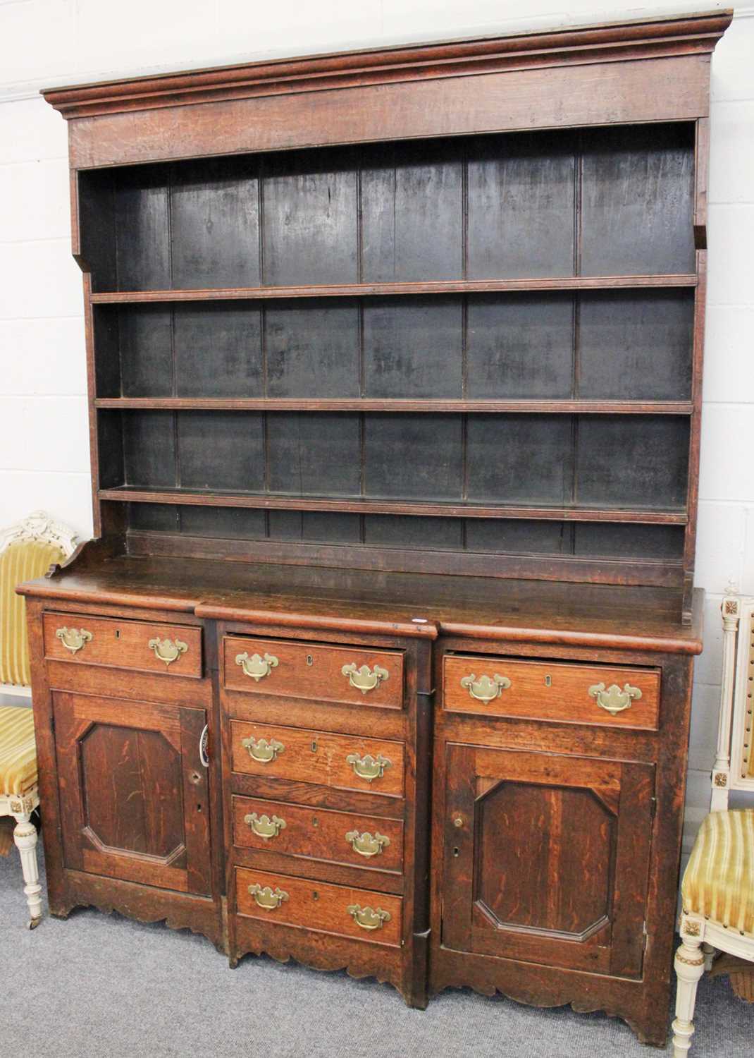 Lot 1307 - An 18th Century Oak Breakfront Dresser and