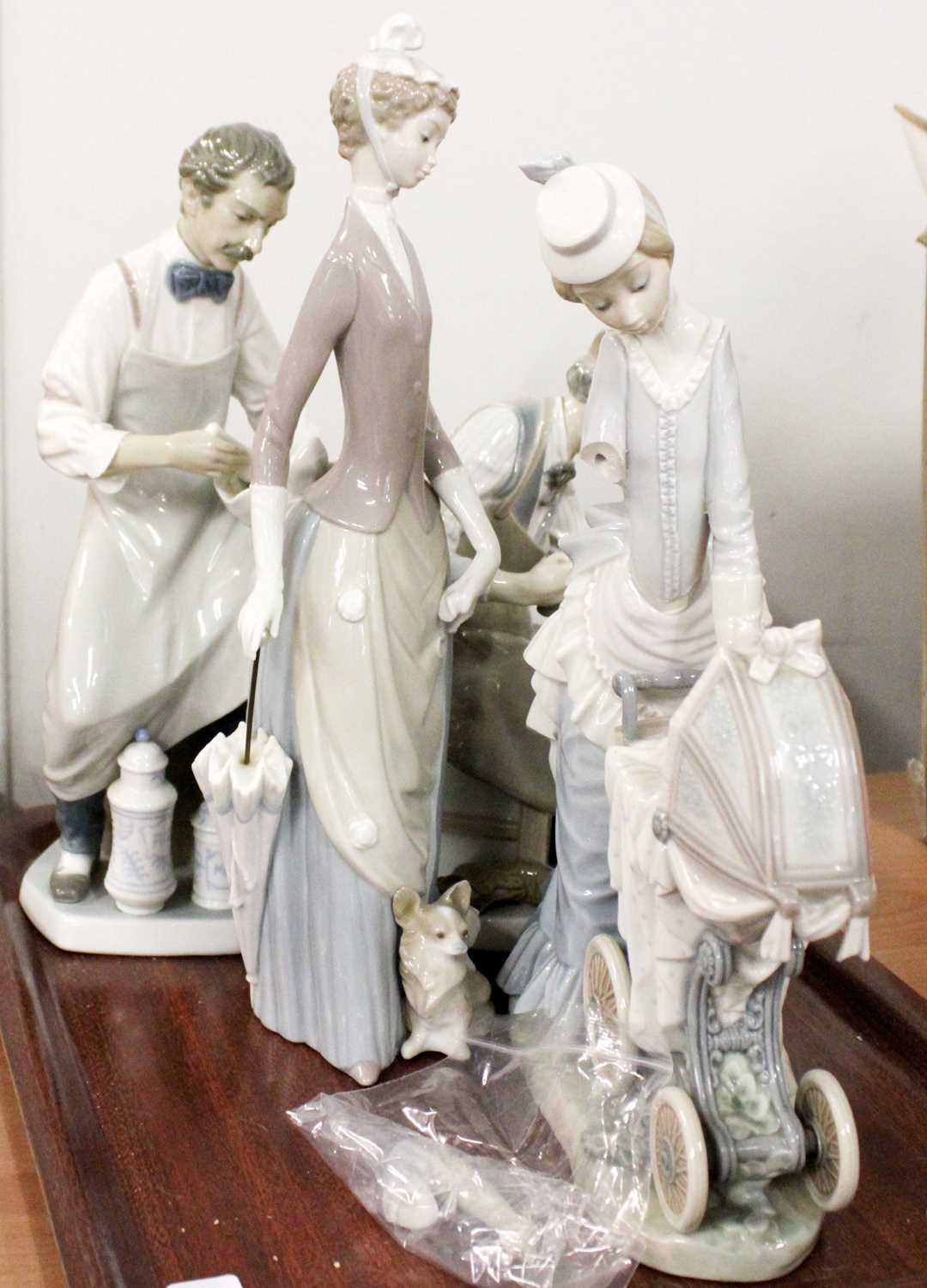 Lot 444 - Four Lladro Figures, Apothecary, Shoemaker,