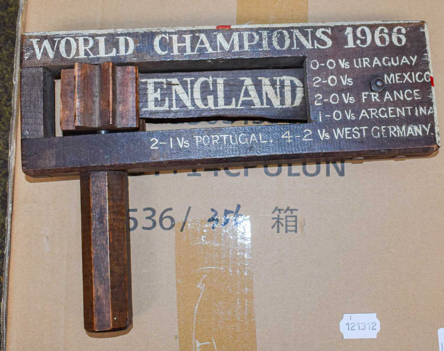 Lot 59 - A WWII Air Raid Rattle, painted to