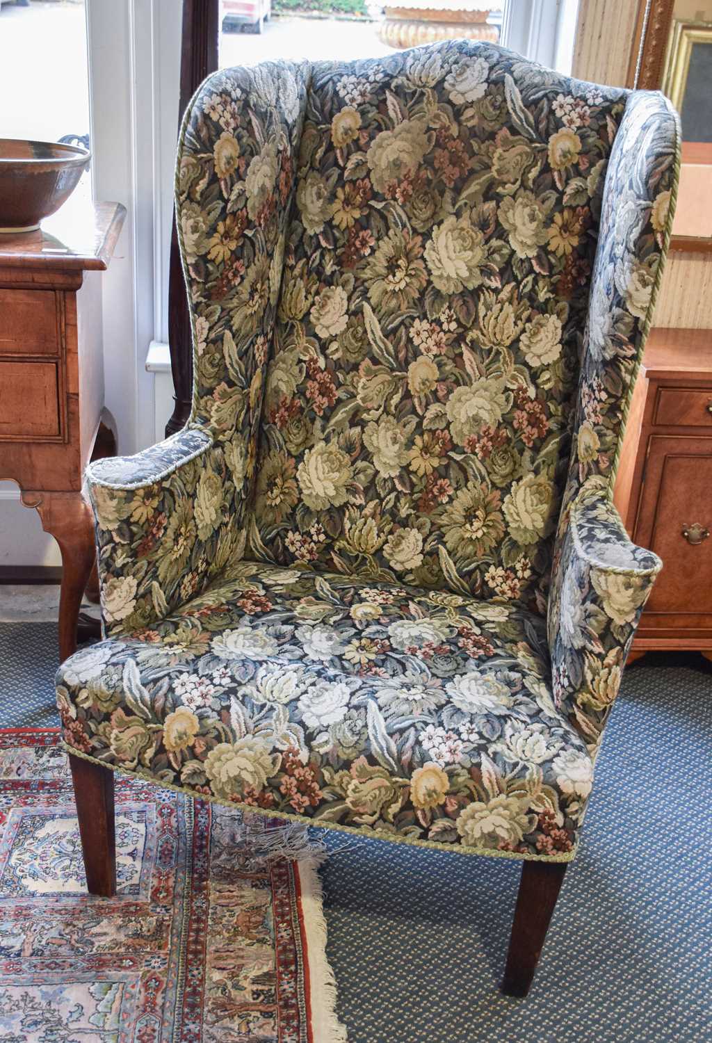 Lot 1343 - A George III Wing Chair, with later floral