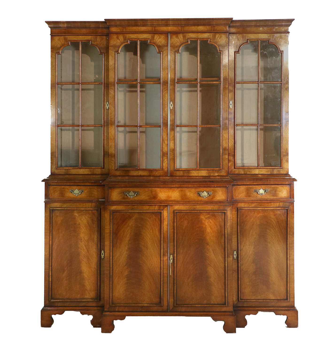 Lot 1281 - A 1920/30 Walnut Breakfront Bookcase, the