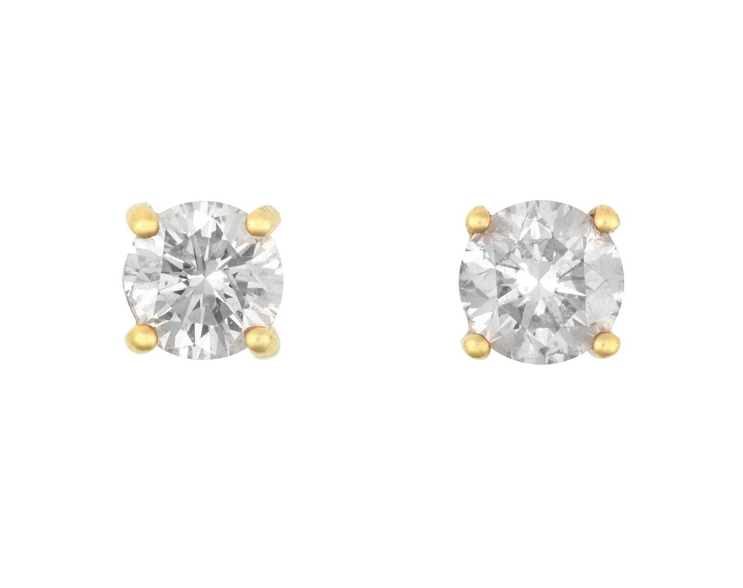 Lot 2242 - A Pair of Diamond Solitaire Earrings the