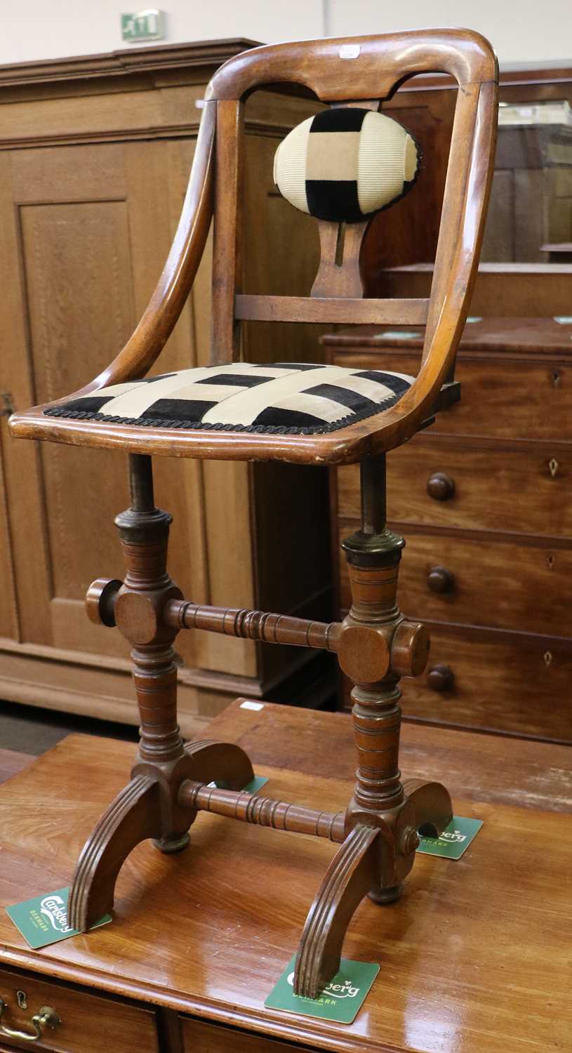Lot 1339 - An Adjustable Music Chair, on turned and