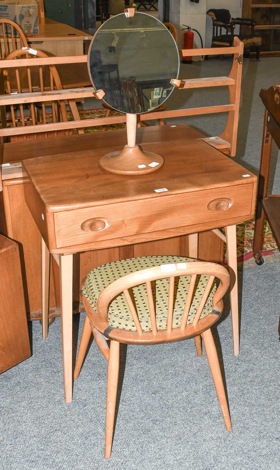 Lot 1139 - A Ercol Light Elm Dressing table, with