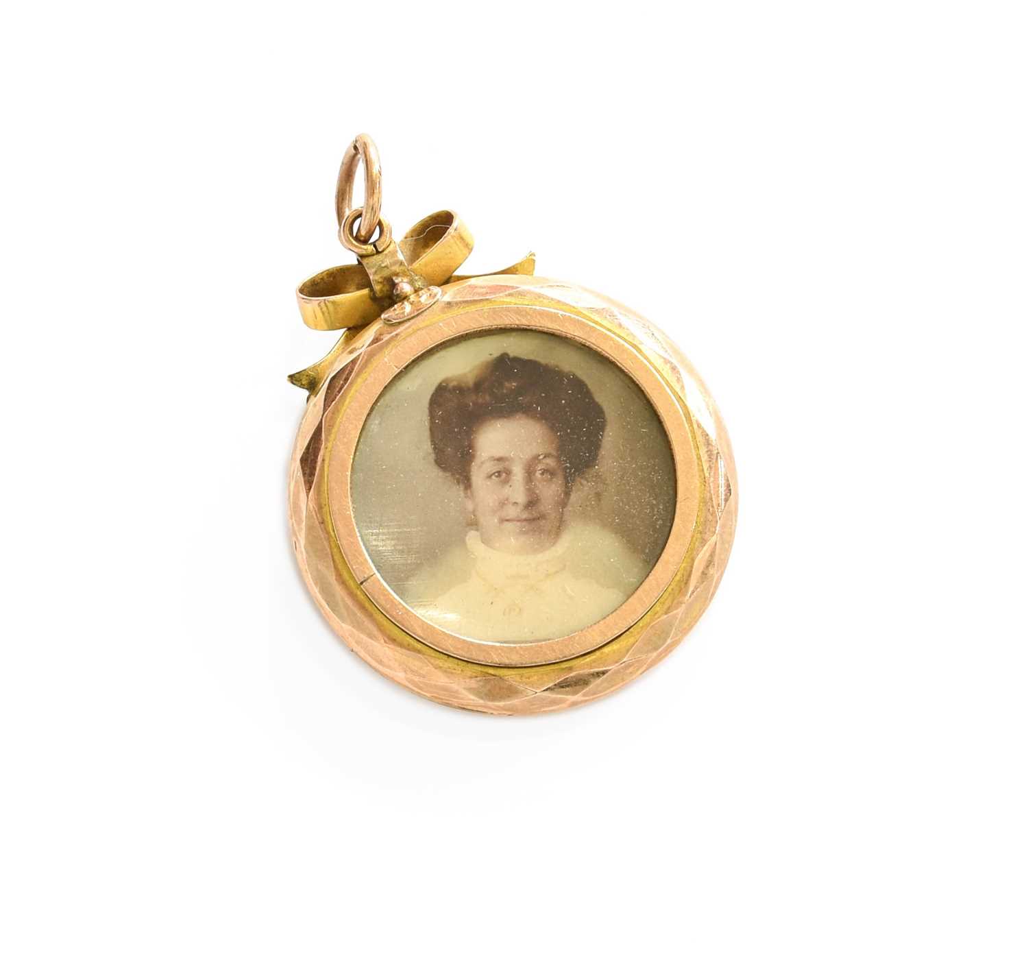 Lot 42 - A Double Sided Locket, the circular locket